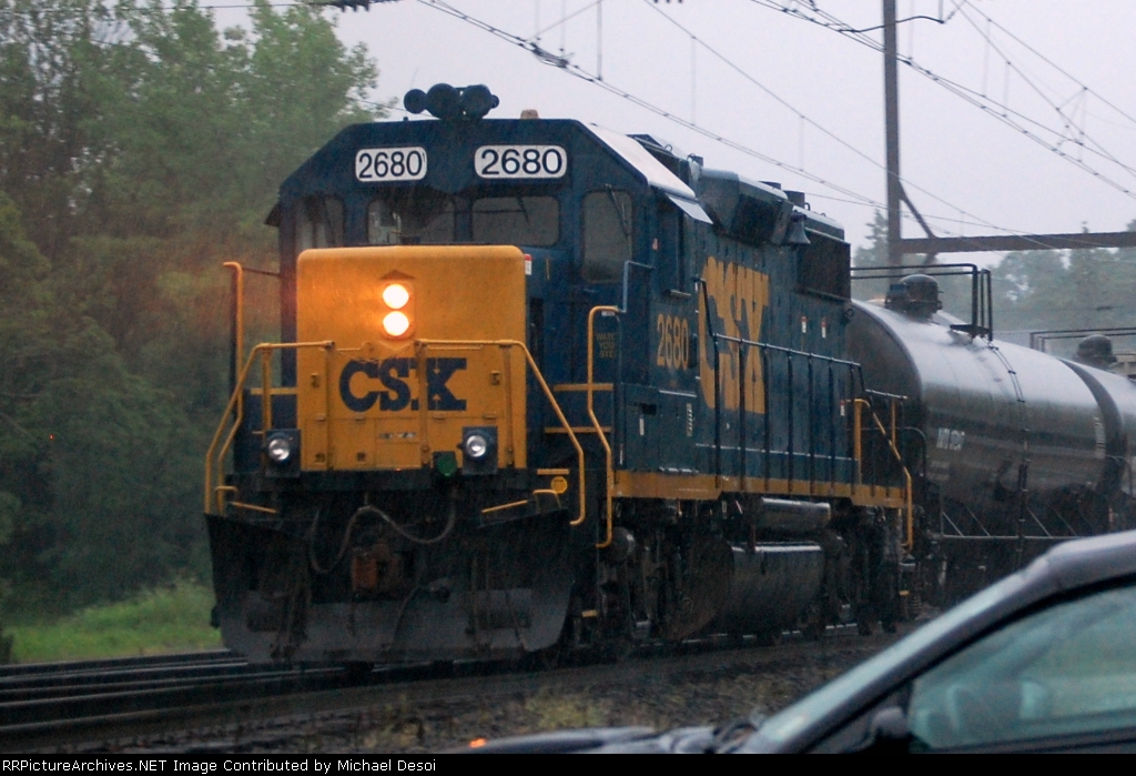 CSX GP-38-2 #2680 is on the rear of a local in the rain through the Passenger Station